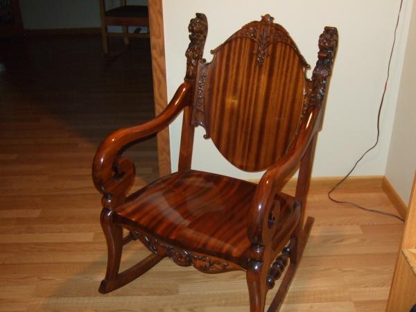 Rocking chair with carved lion heads | InstAppraisal
