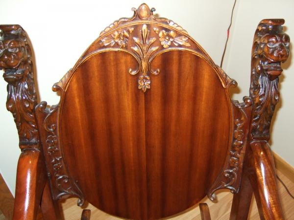 Rocking chair with carved lion heads | InstAppraisal